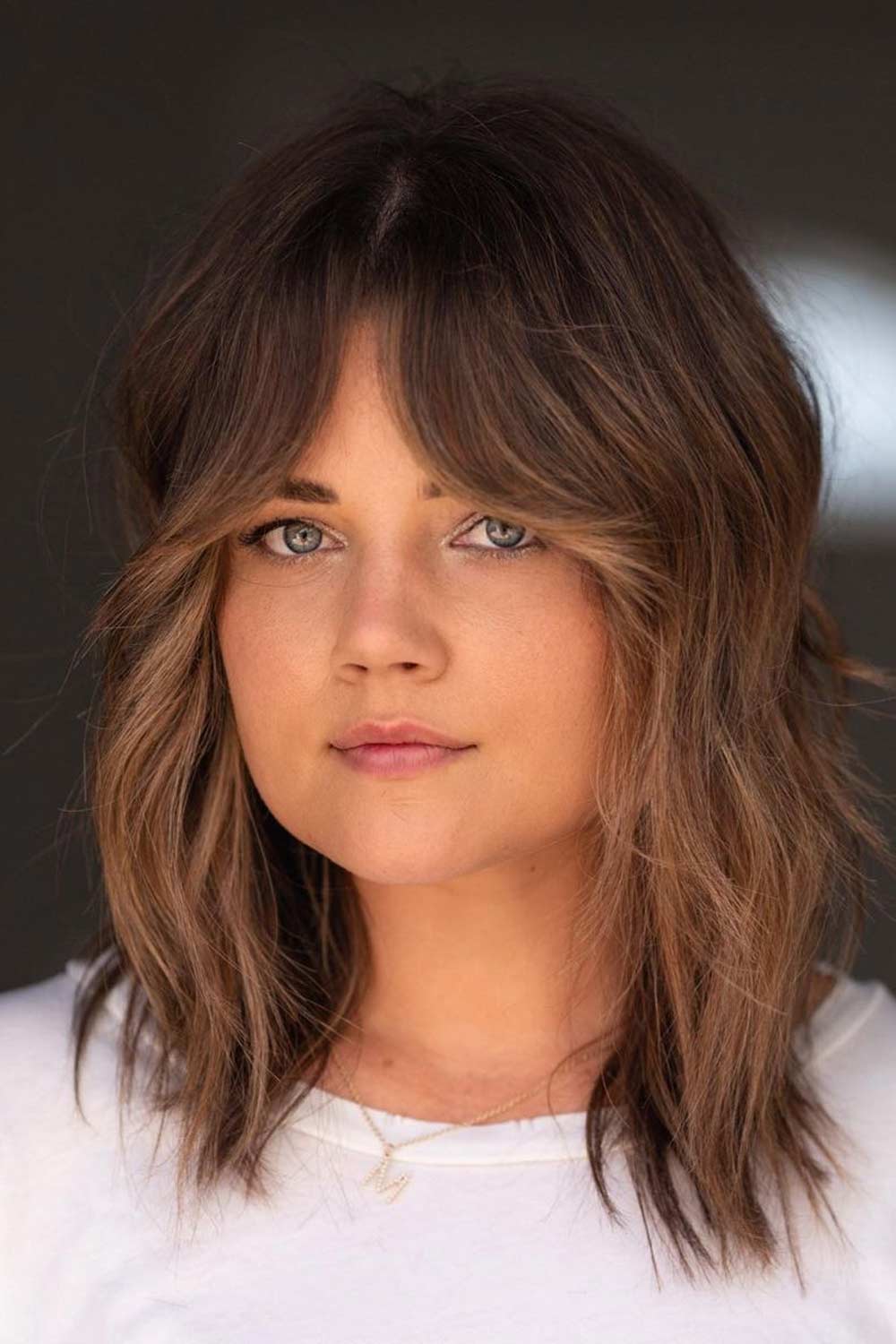 Upgrade Your Look: Medium Hairstyles with Bangs - Glaminati